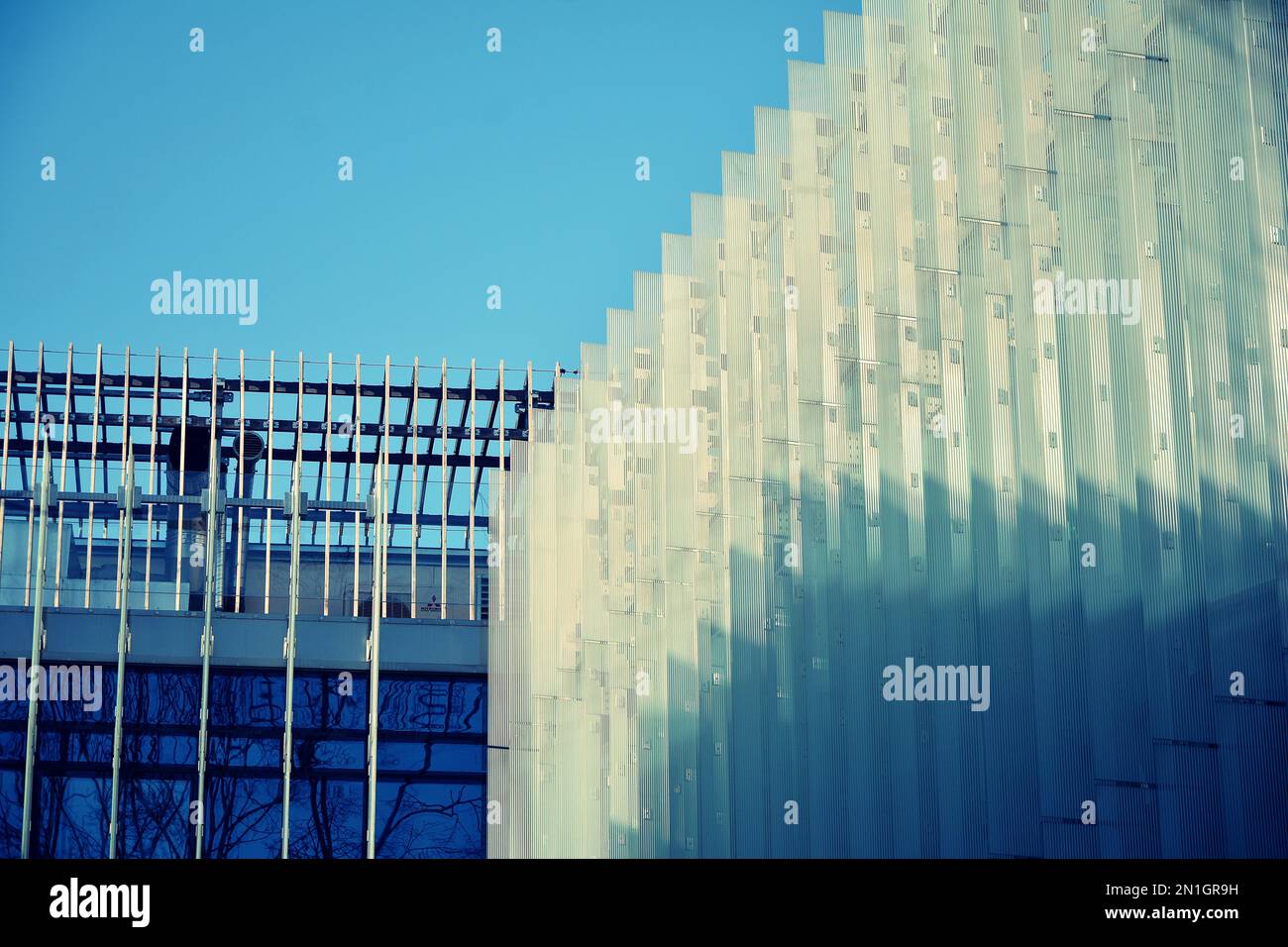 Modern office building on a clear sky background. Retro stylized ...