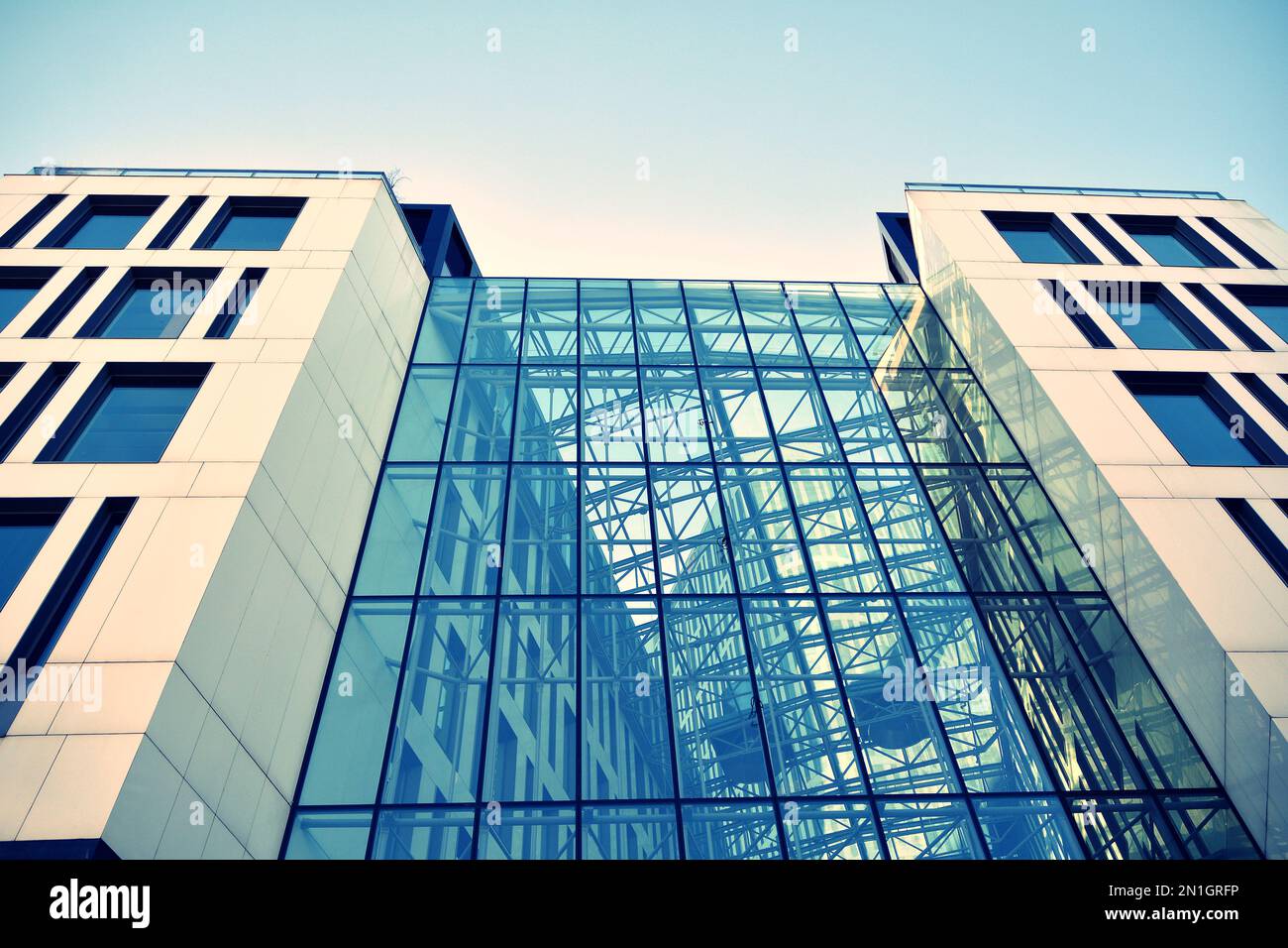 Modern office building on a clear sky background. Retro stylized ...