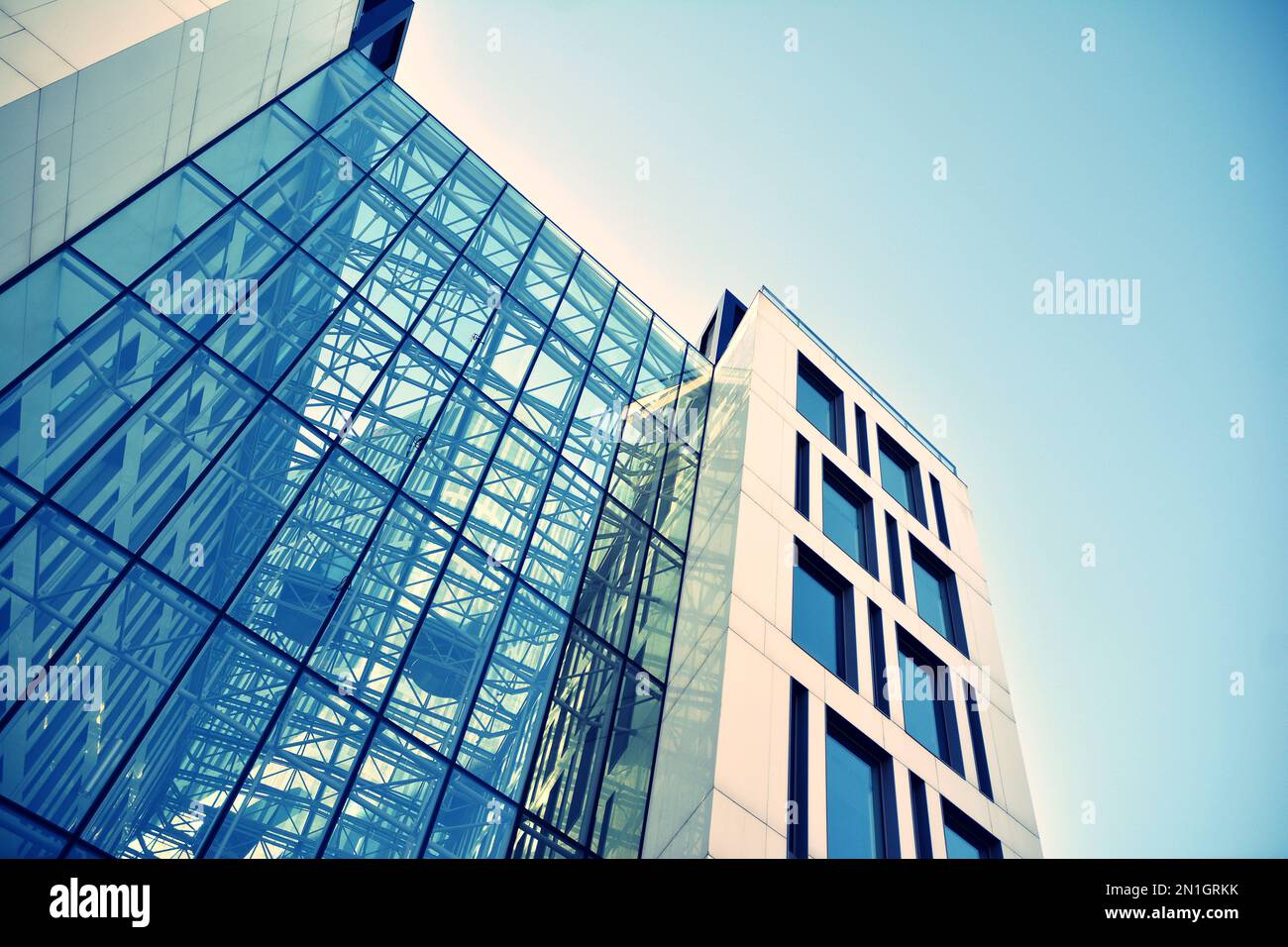 Modern office building on a clear sky background. Retro stylized ...