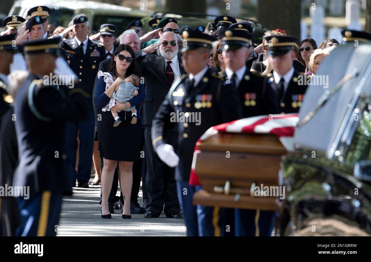 Meghan Florich, widow of Army Staff Sgt. Thomas Florich III, holds ...