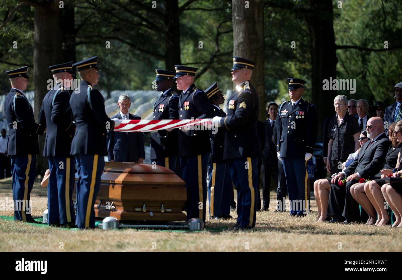 Army Secretary John McHugh, stands left behind the casket of Army Staff ...