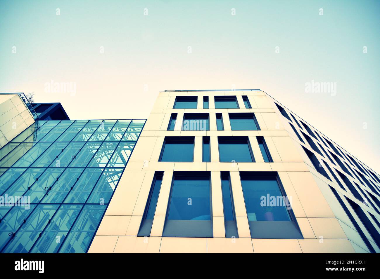 Modern office building on a clear sky background. Retro stylized ...