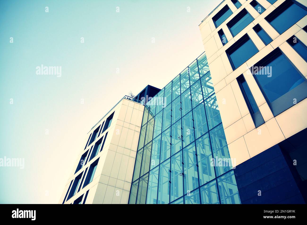 Modern office building on a clear sky background. Retro stylized ...