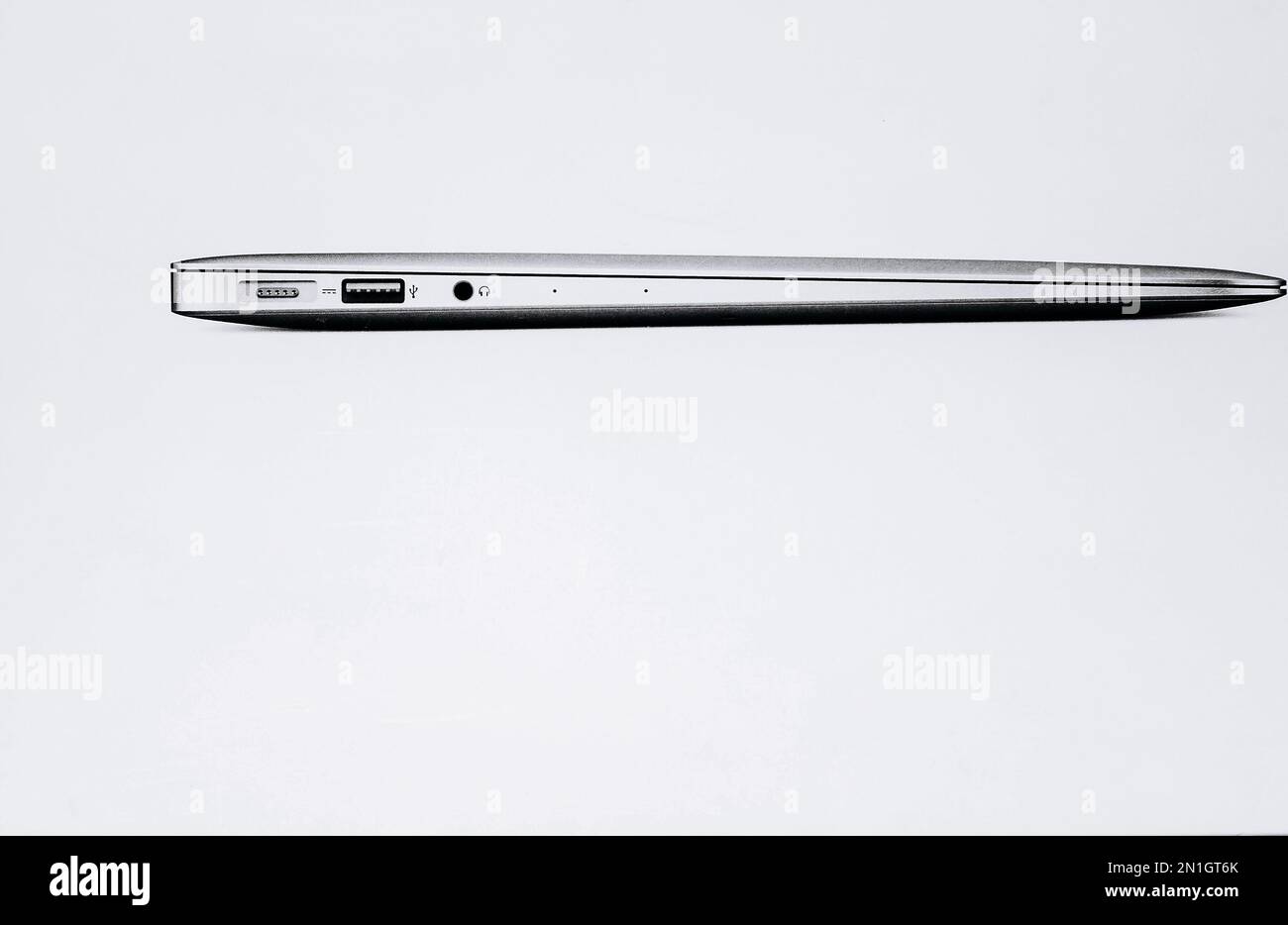 The silver laptop computer side view on the white background Stock ...
