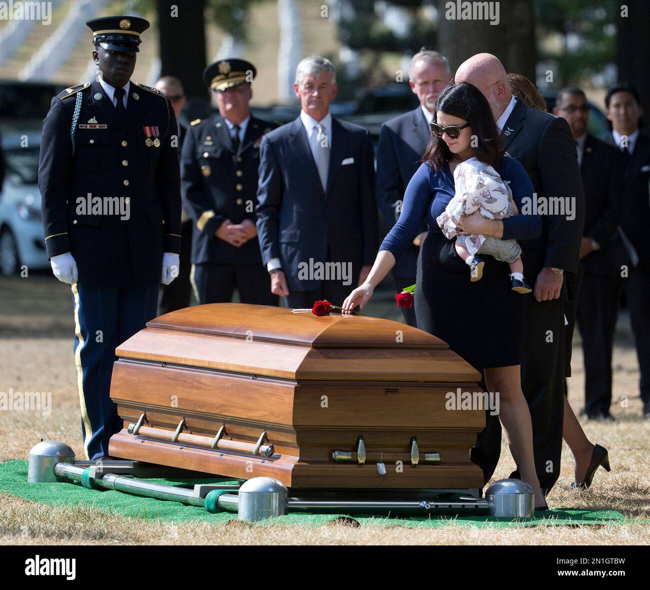 Meghan Florich, widow of Army Staff Sgt. Thomas Florich III, holds ...