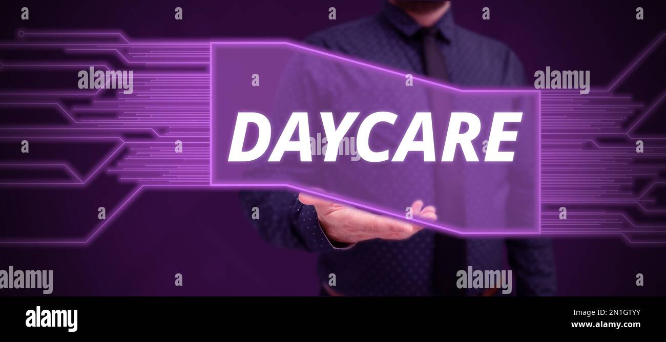 Hand writing sign Daycare, Word for offering care to preschool children ...