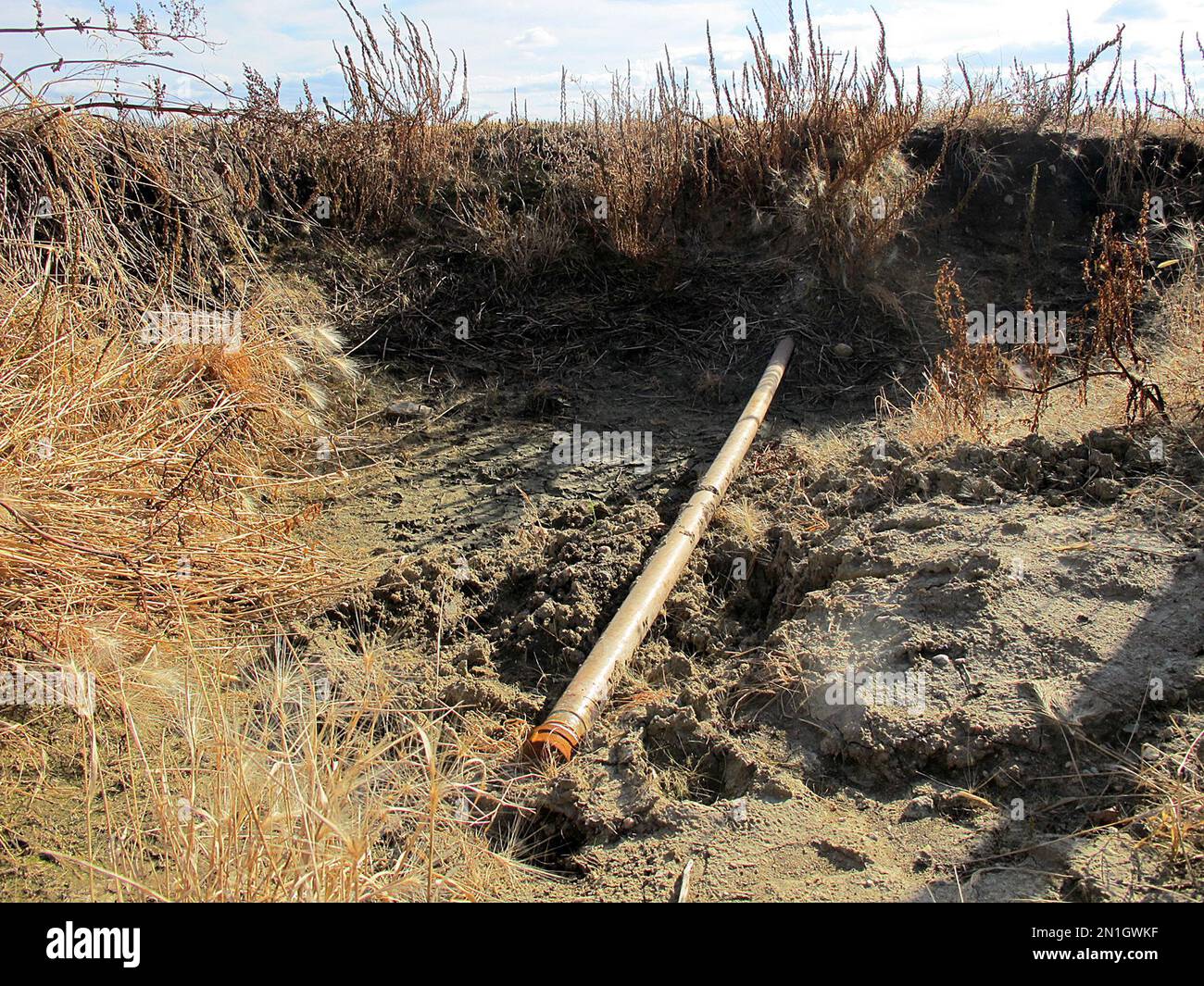 This photo taken Oct. 22, 2014, shows a broken pipeline that leaked ...