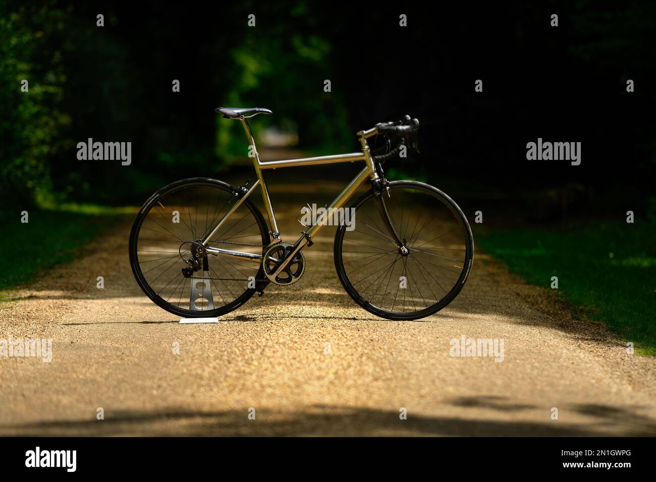 A titanium bicycle (a Van Nicholas Zephyr) in photographed on a gravel ...