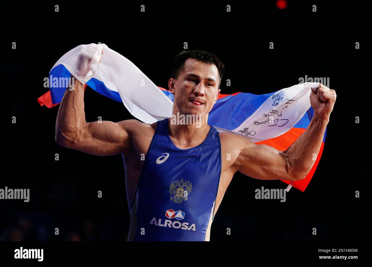 Roman Vlasov, of Russia, celebrates after defeating Mark Overgaard ...