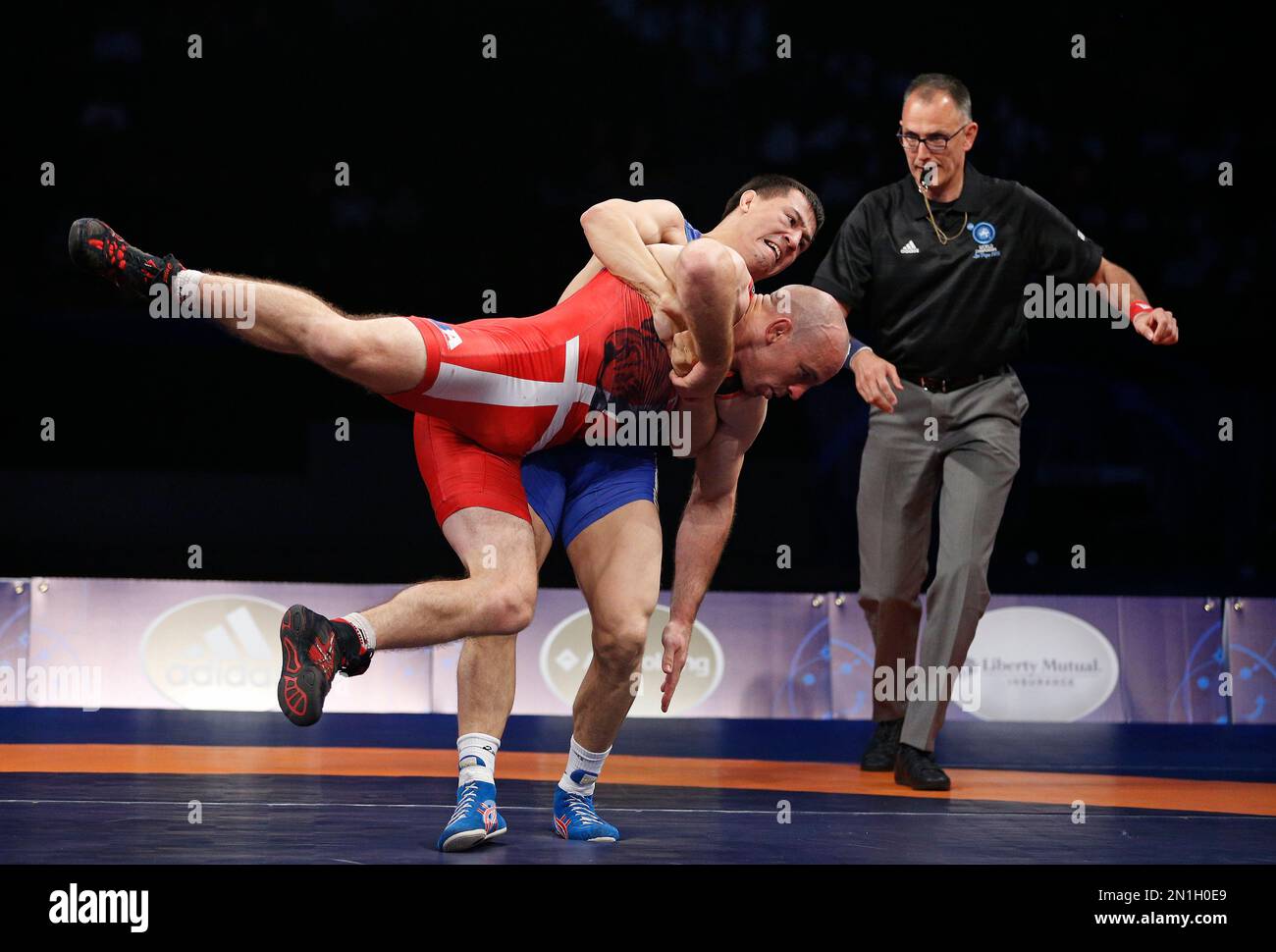 Roman Vlasov, of Russia, in blue, wrestles with Mark Overgaard Madsen ...
