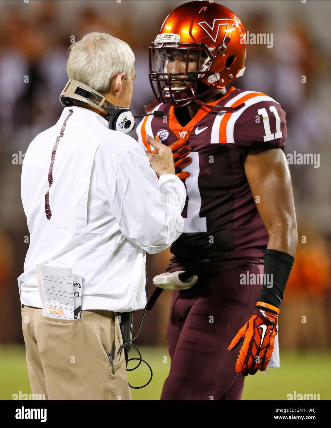 Virginia Tech head coach Frank Beamer, left, talks with Virginia Tech ...