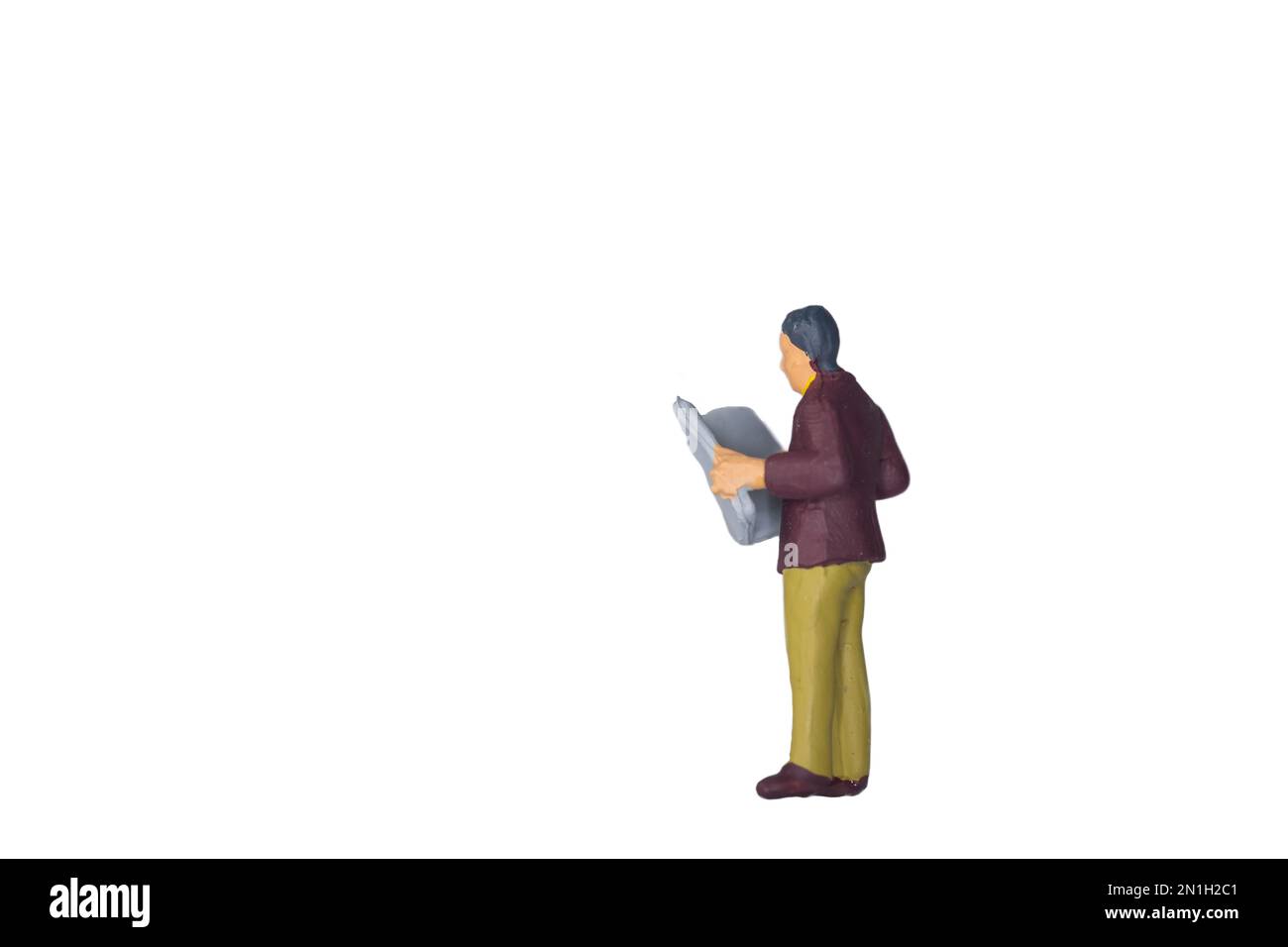 a man reading a newspaper isolated on white background, side view Stock ...