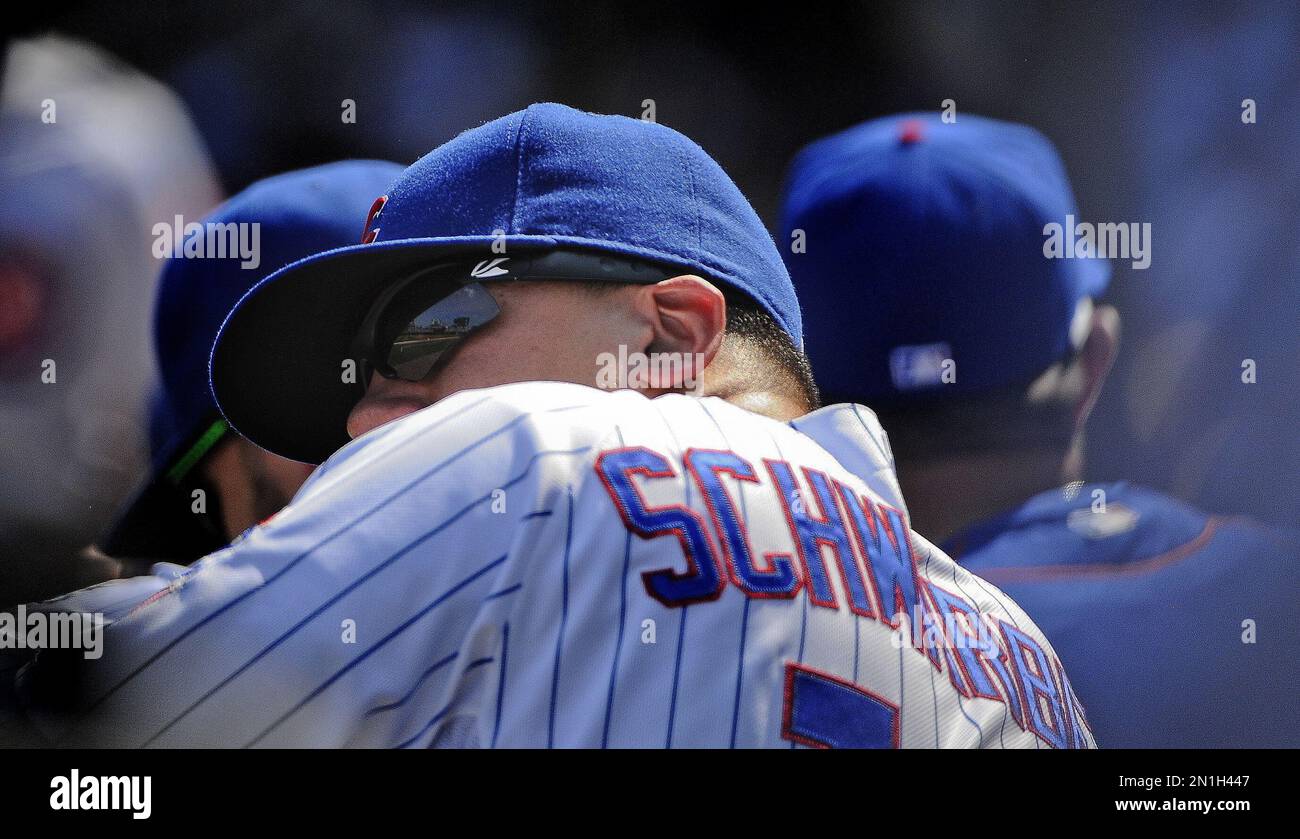 Chicago Cubs left fielder Kyle Schwarber (12) sits on the bench in the ...
