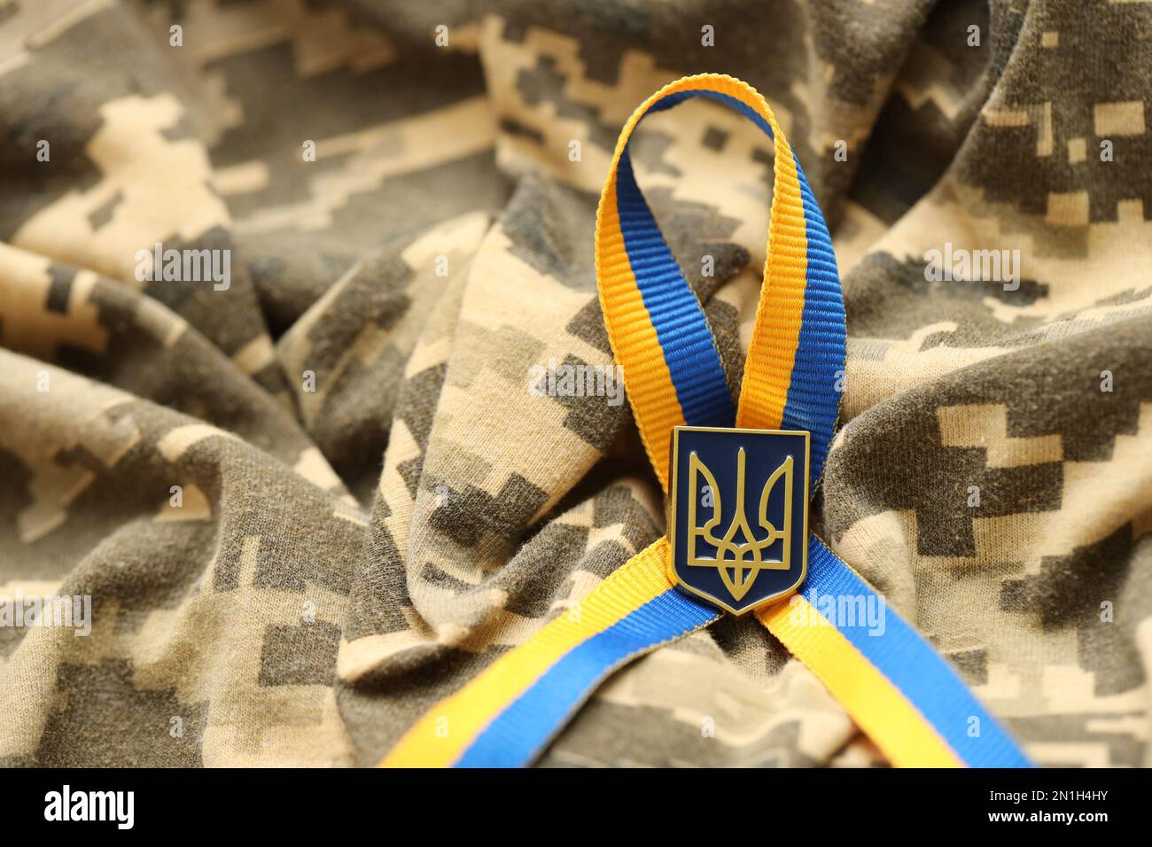 Pixeled digital military camouflage fabric with ukrainian flag and coat ...