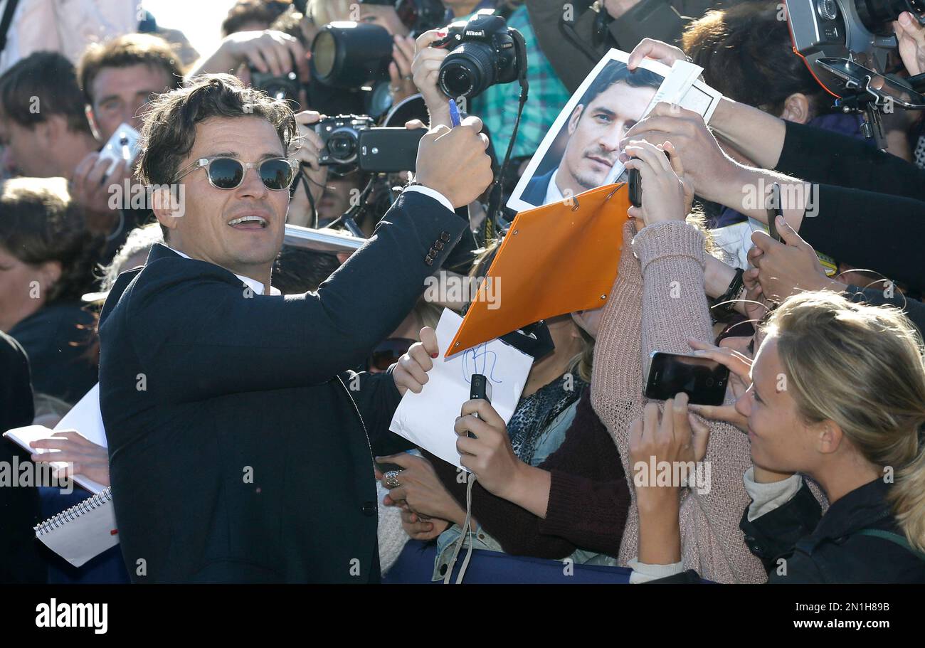 British actor Orlando Bloom signs autographs as he meets fans, at the ...