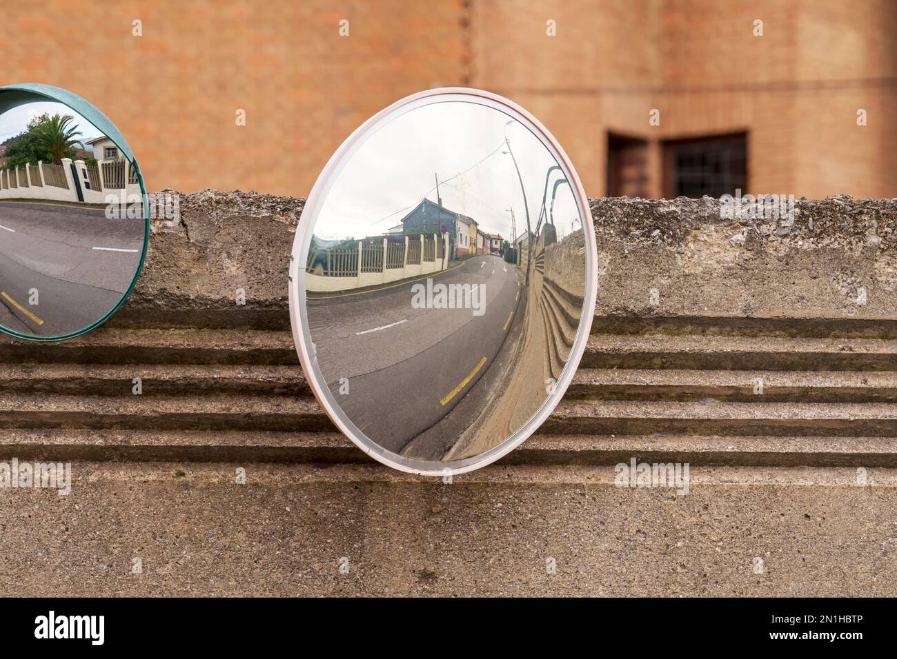 Round convex traffic safety mirror reflecting a rural street Stock ...