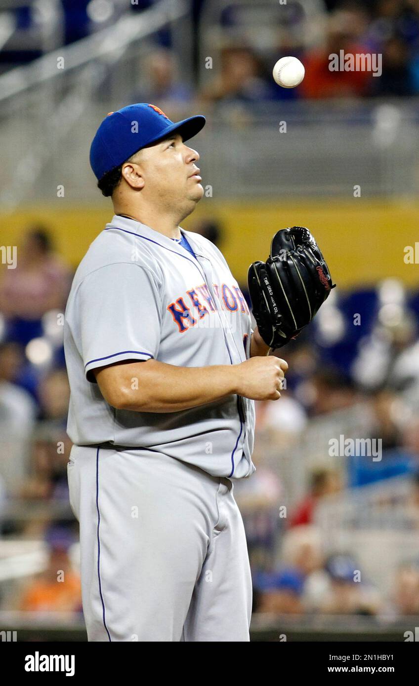 New York Mets starting pitcher Bartolo Colon (40) flips the ball before ...
