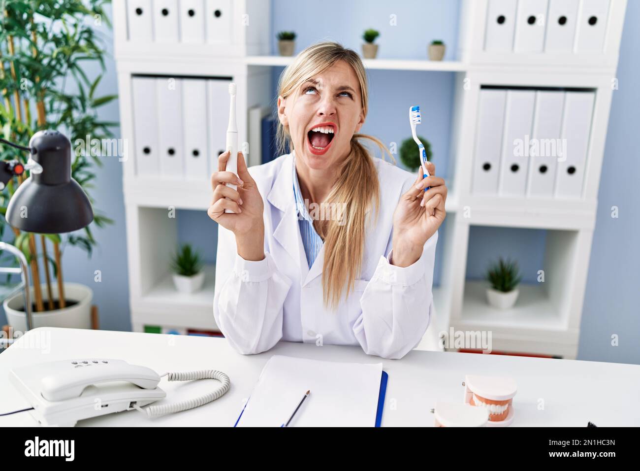 Mad woman brushing teeth hi-res stock photography and images - Alamy