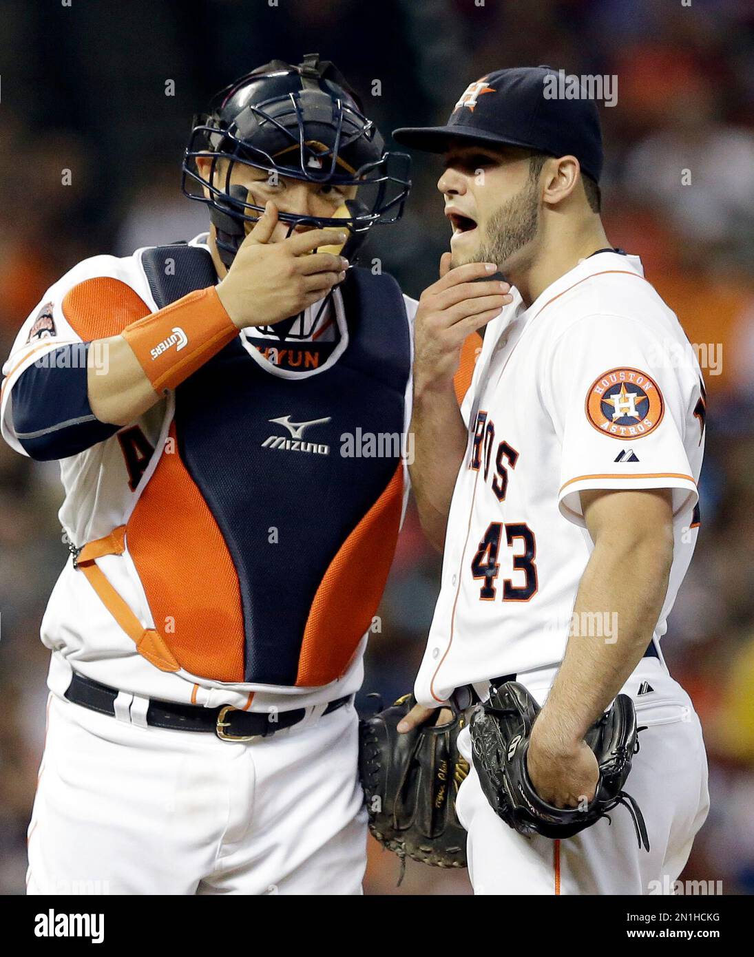 Houston Astros catcher Hank Conger talks to starting pitcher Lance ...