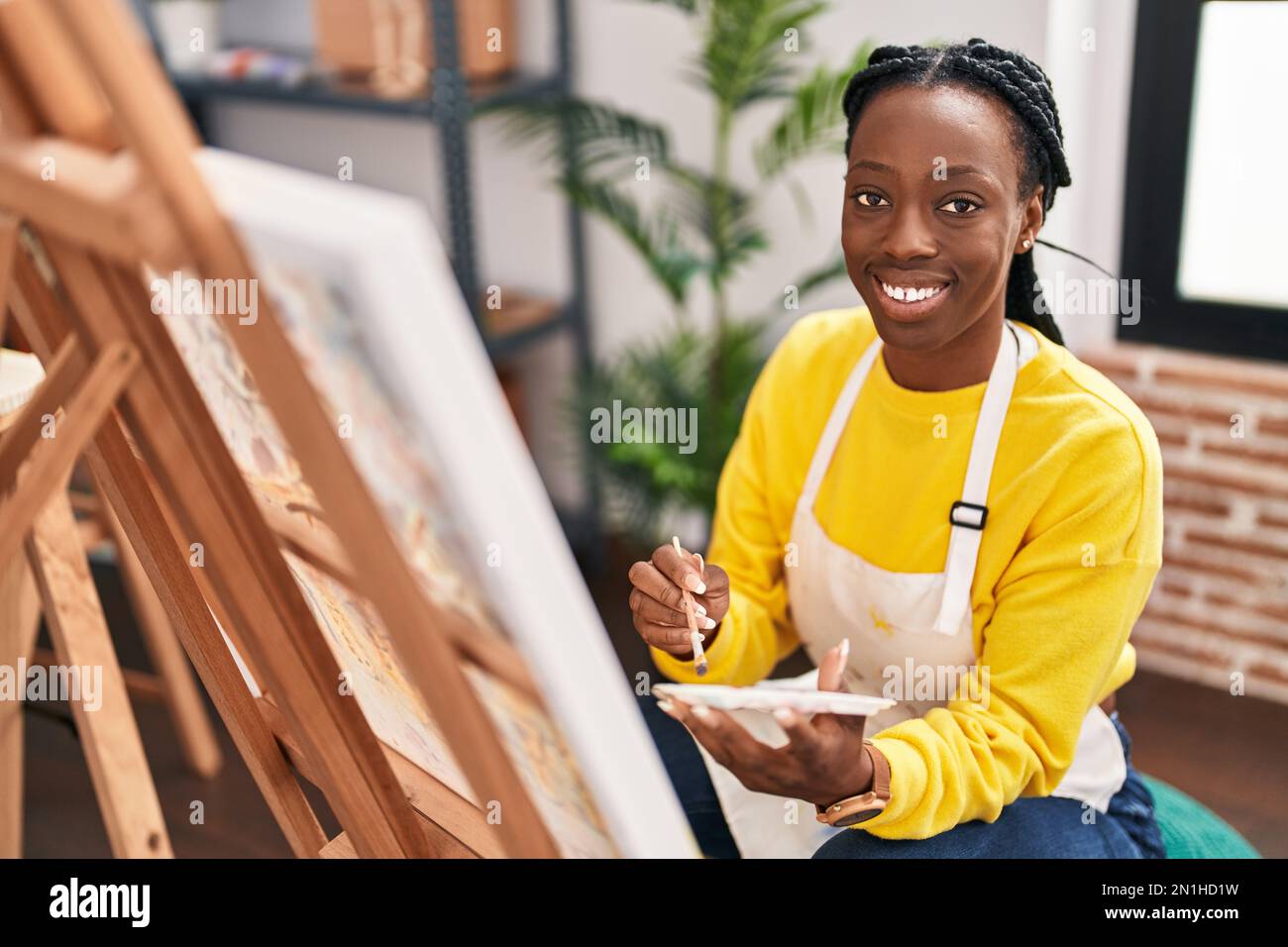 African american woman artist smiling confident drawing at art studio ...