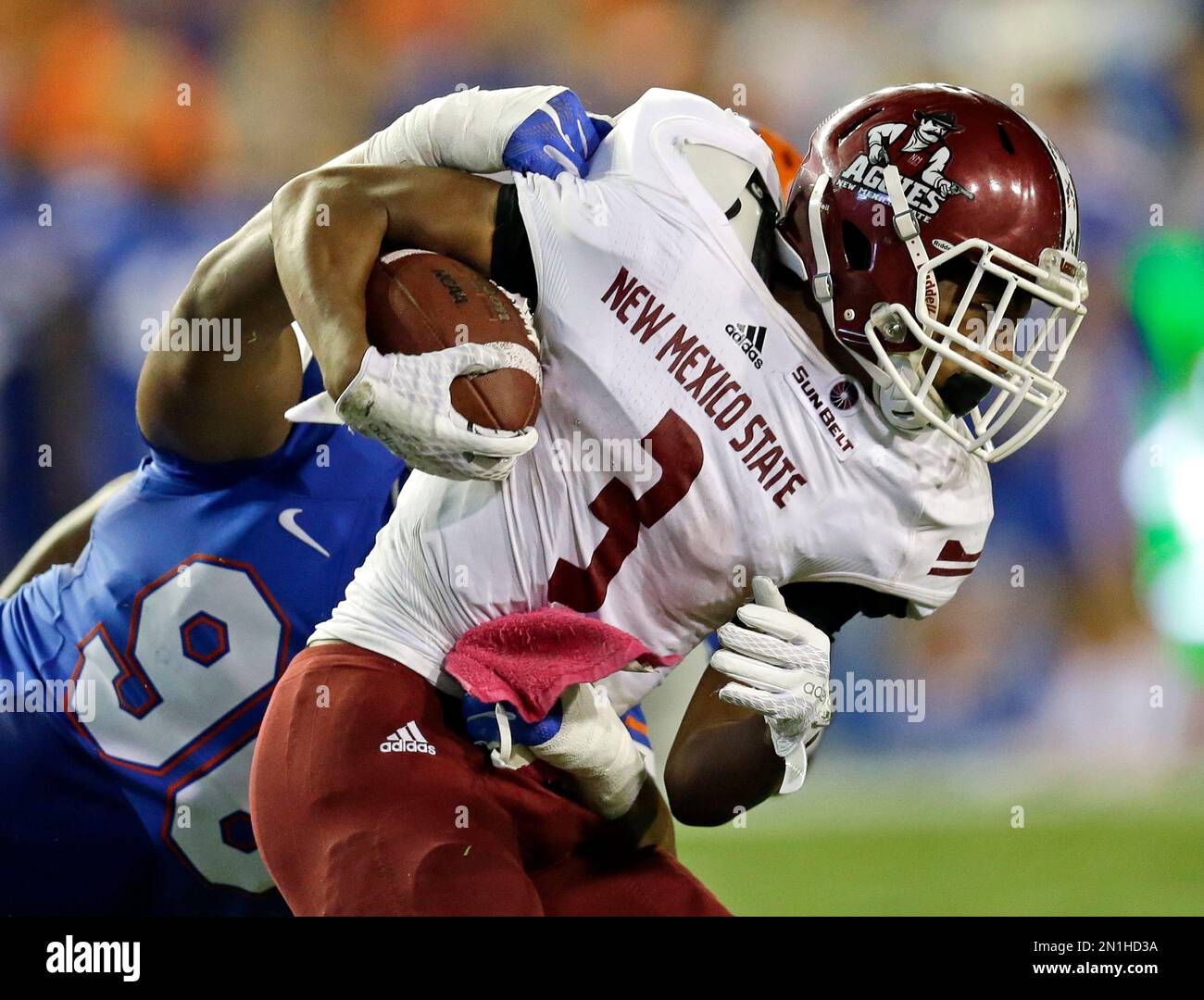New Mexico State running back Larry Rose III (3) gains yardage before ...