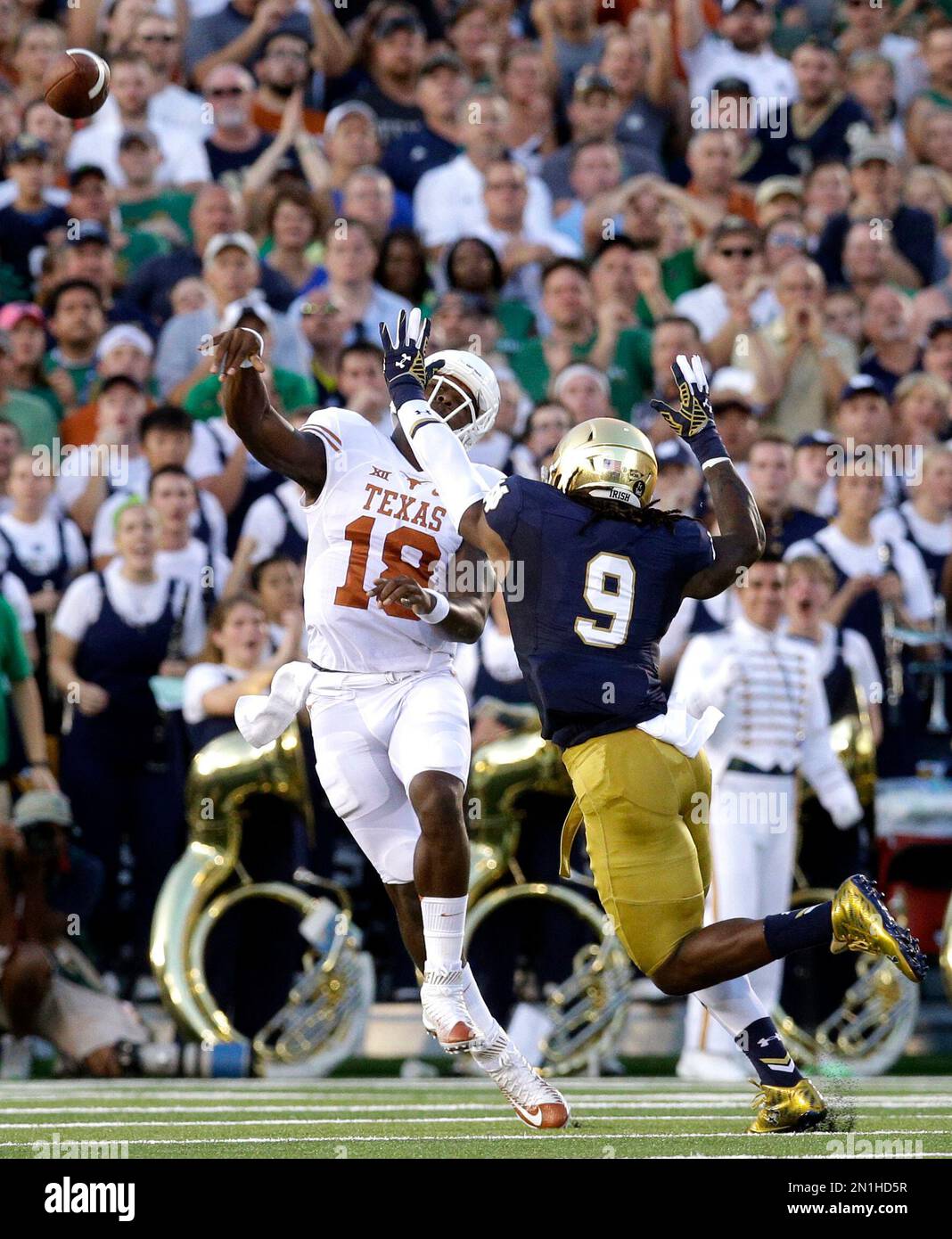 Texas quarterback Tyrone Swoopes, left, throws a pass against Notre ...