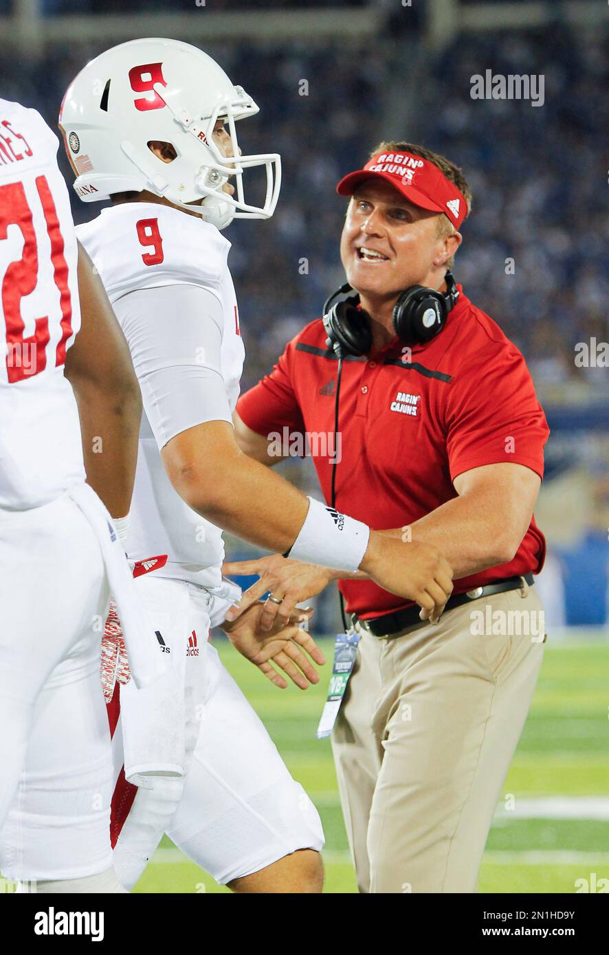 Louisiana-Lafayette head coach Mark Hudspeth, right, celebrates his ...