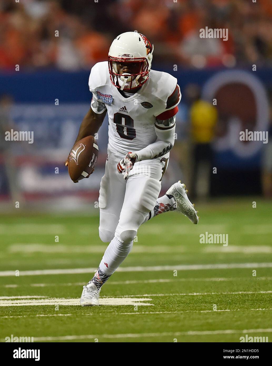 Louisville quarterback Lamar Jackson (8) runs against Auburn during the ...