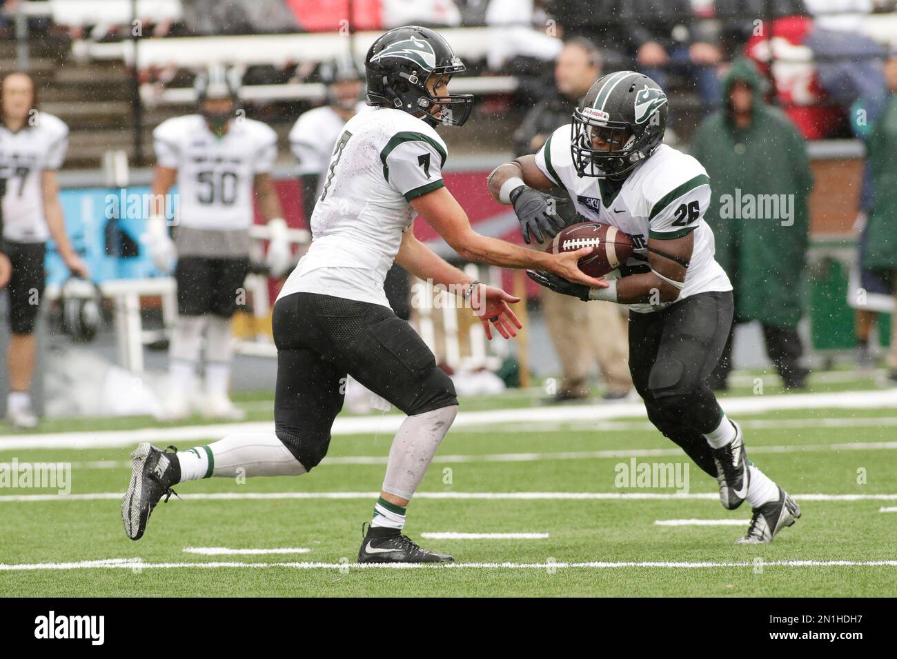 Portland State quarterback Alex Kuresa (7) hands the ball off to ...