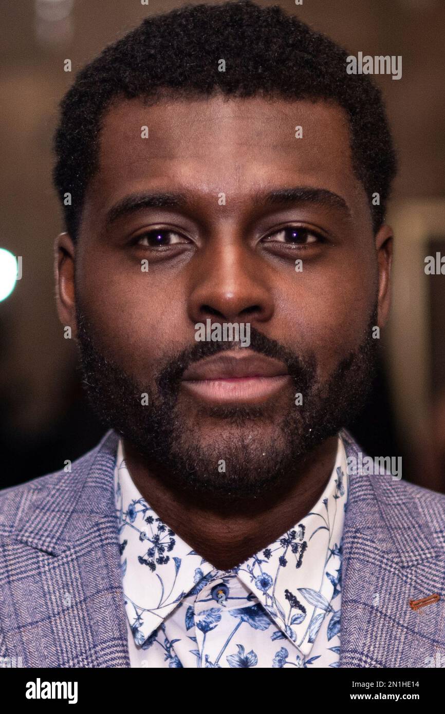 Kwame Augustine poses for photographers upon arrival at the Critics' Circle Film Awards in ...