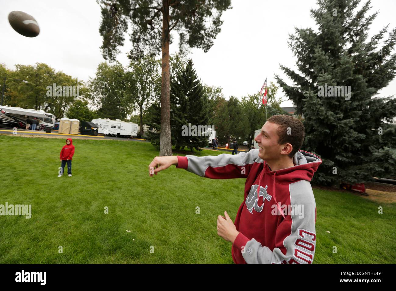 15 year old Danny Johnson, right, plays catch with 9 year old Walker ...
