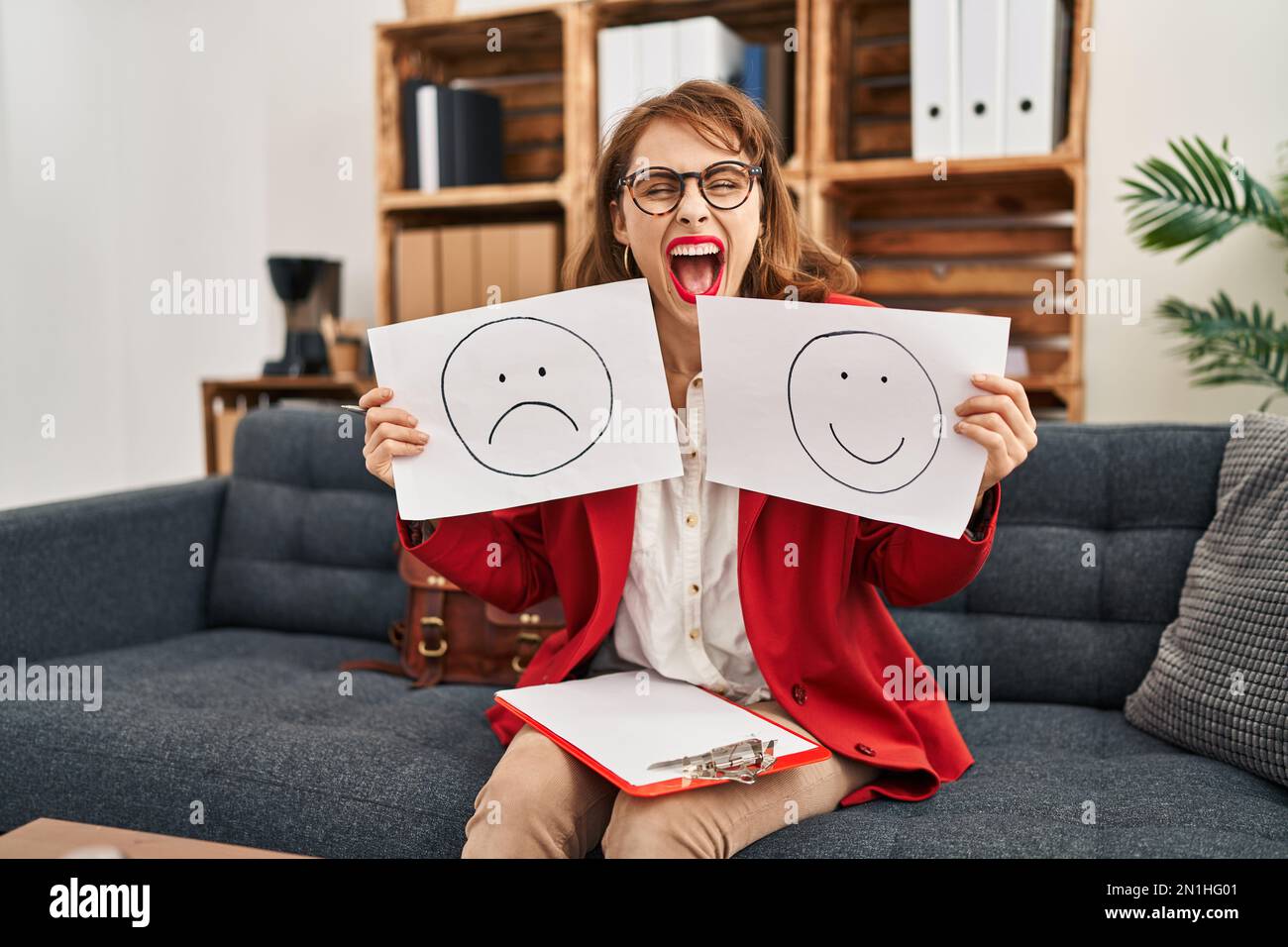 Young beautiful woman working on depression holding sad to happy ...
