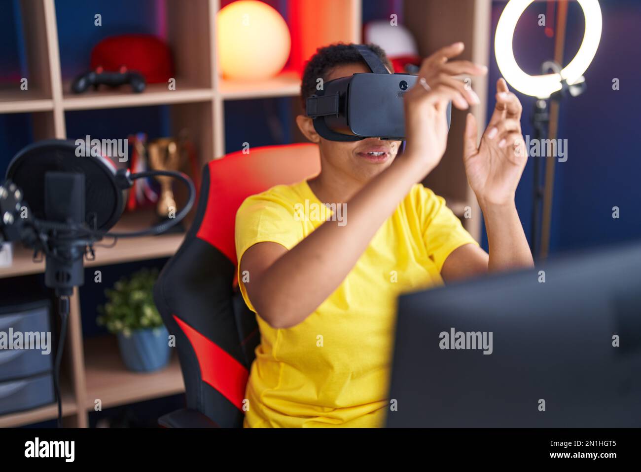 African american woman streamer playing video game using virtual ...