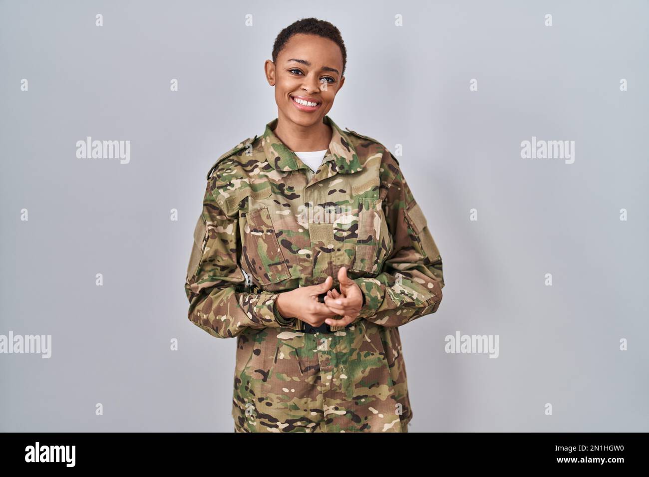 Beautiful african american woman wearing camouflage army uniform with ...
