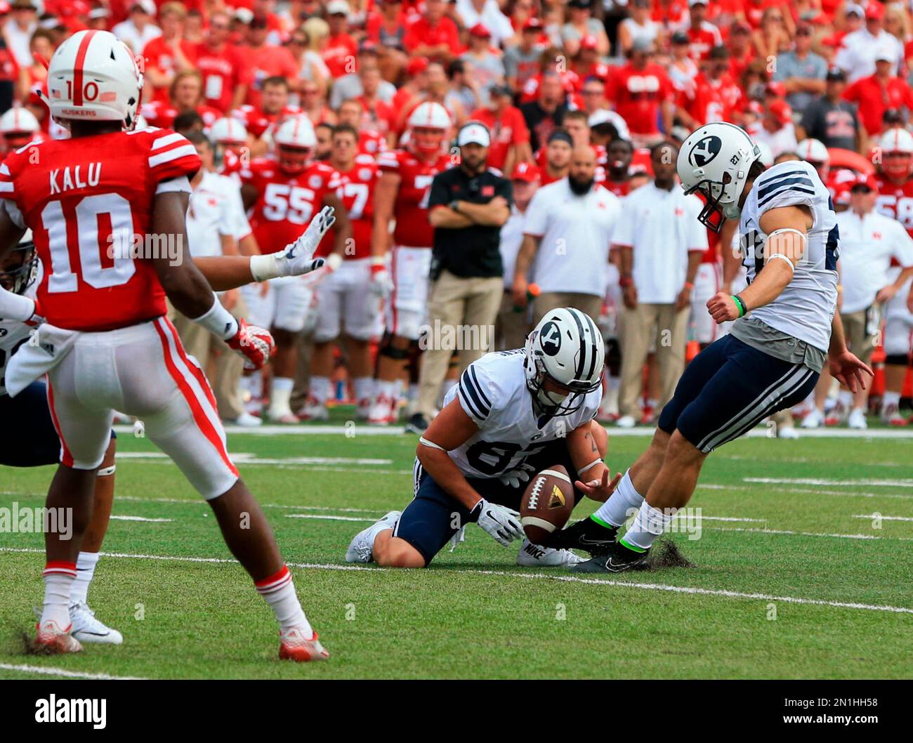 BYU kicker Trevor Samson, right, kicks an extra point as Nebraska ...