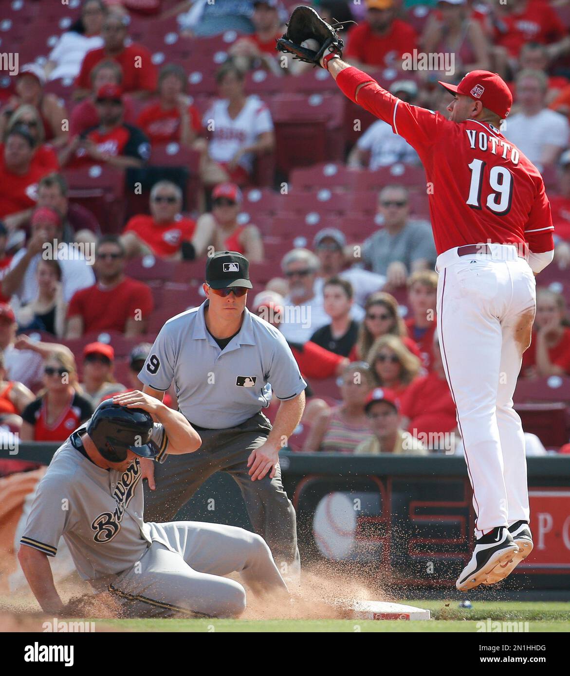 Milwaukee Brewers' Logan Schafer, left, beats the throw on a return to ...