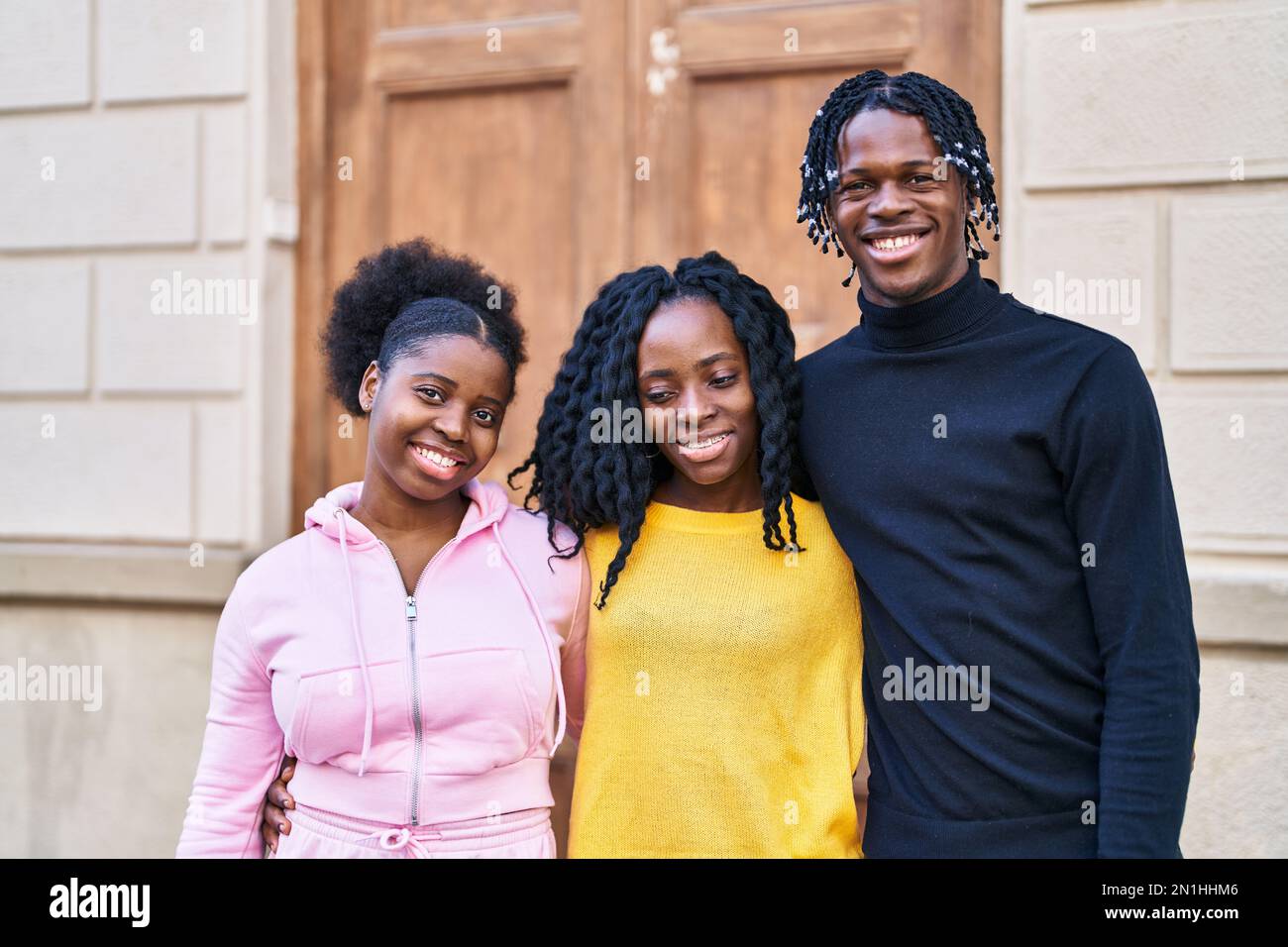 African american friends smiling confident standing together at street ...