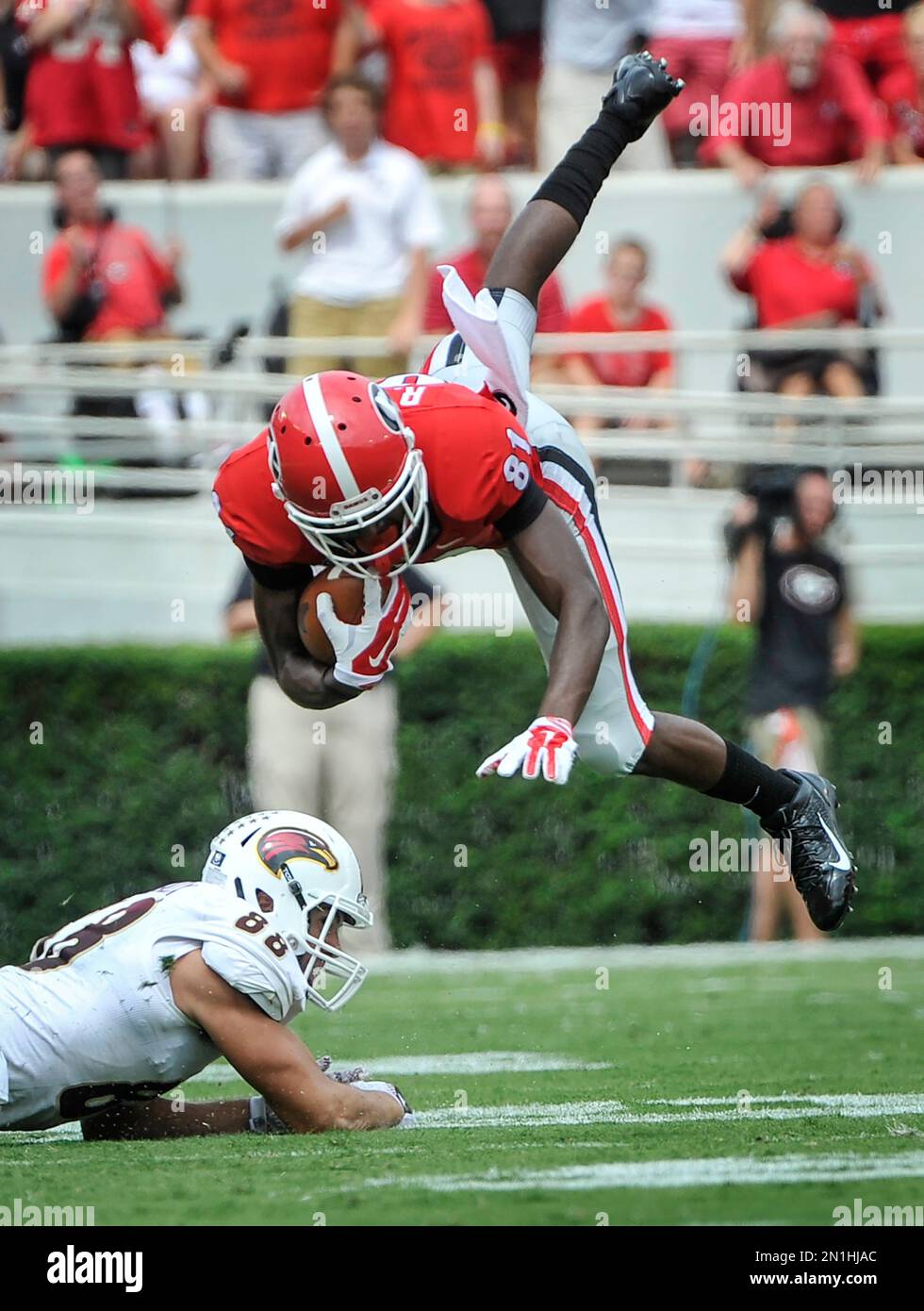 Georgia wide receiver Reggie Davis (81) is upended by Louisiana Monroe ...