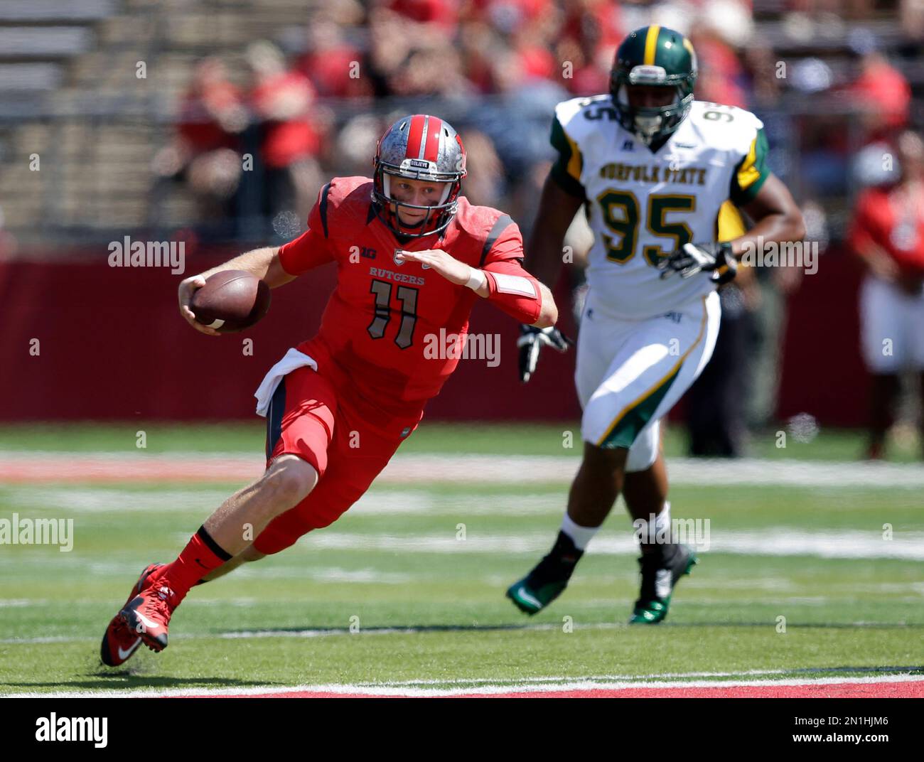 Rutgers quarterback Hayden Rettig (11) scrambles with the ball as ...