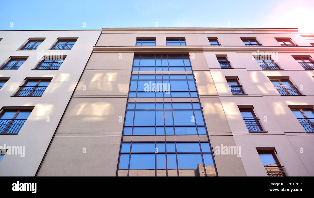 Condominium and apartment building with symmetrical modern architecture ...