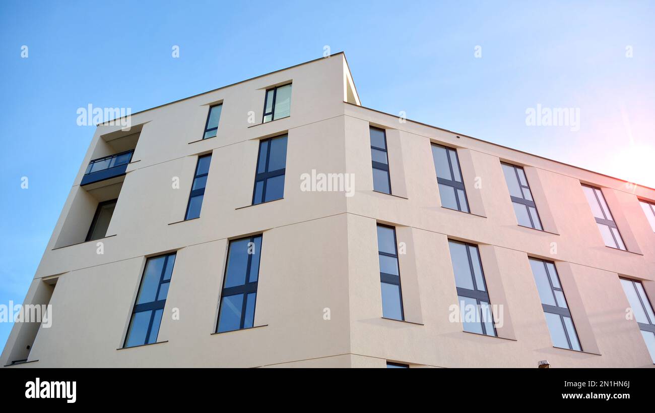 Condominium and apartment building with symmetrical modern architecture ...