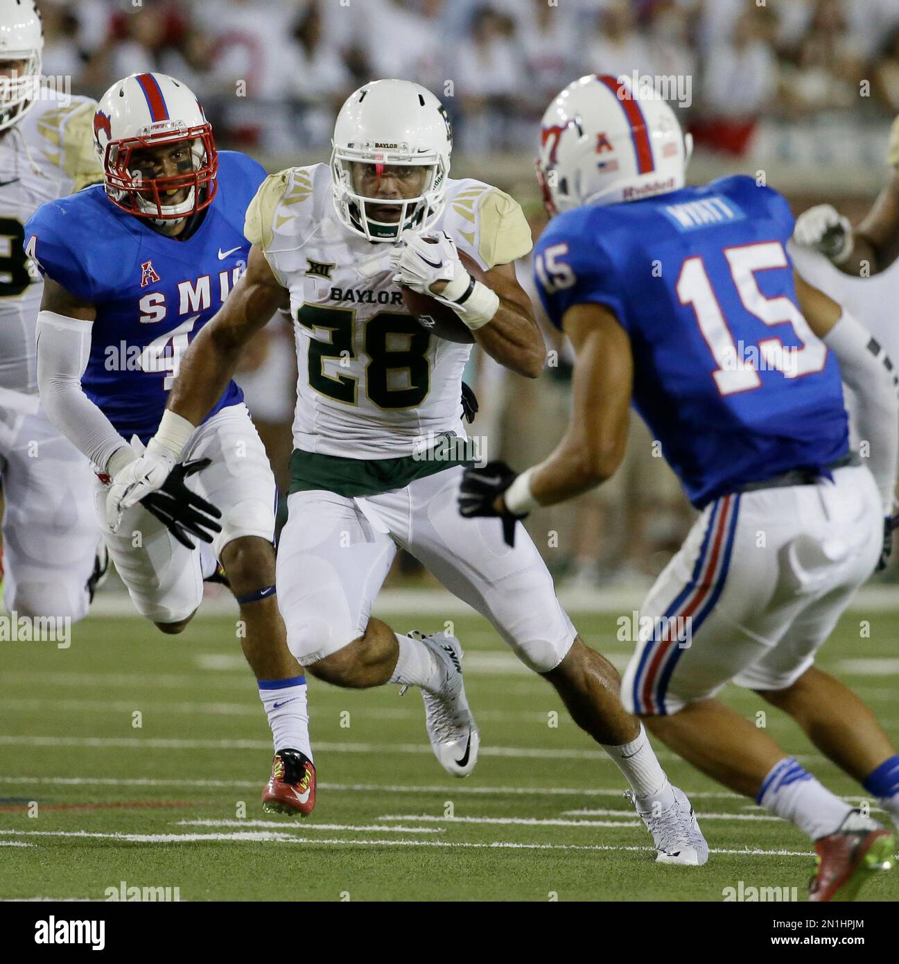Baylor running back Devin Chafin (28) funds against SMU defenders ...
