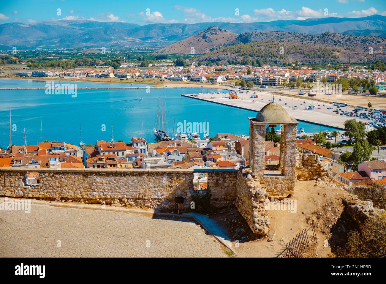 an aerial view of the old town of Napflio, Greece, and its port in the ...