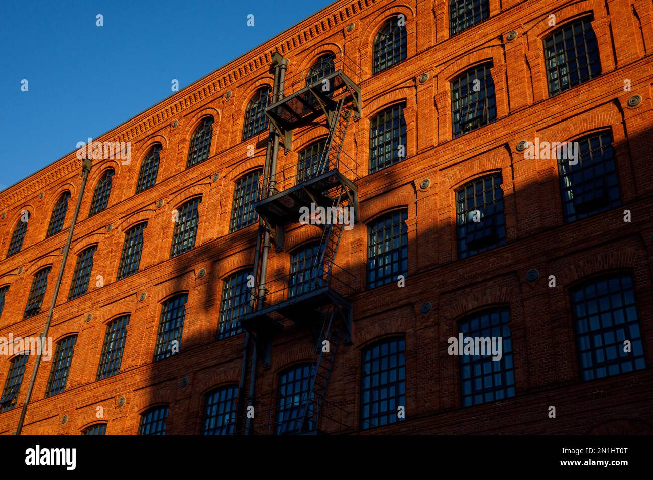 Red brick facade of the factory Stock Photo - Alamy