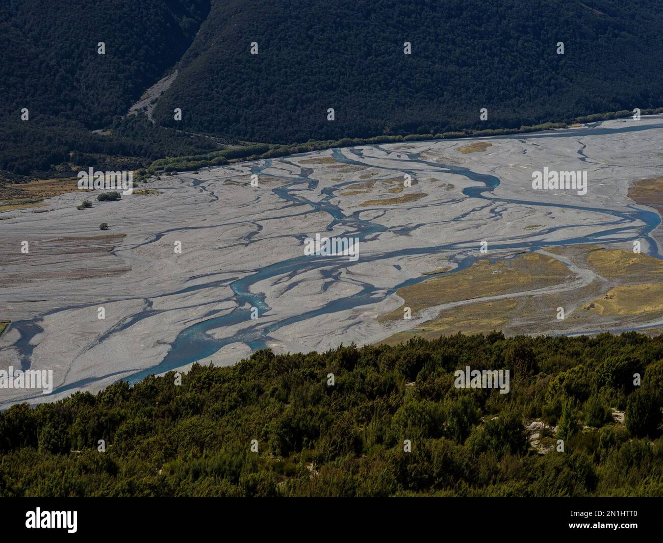 Alpine mountain valley panorama landscape with braided river ...