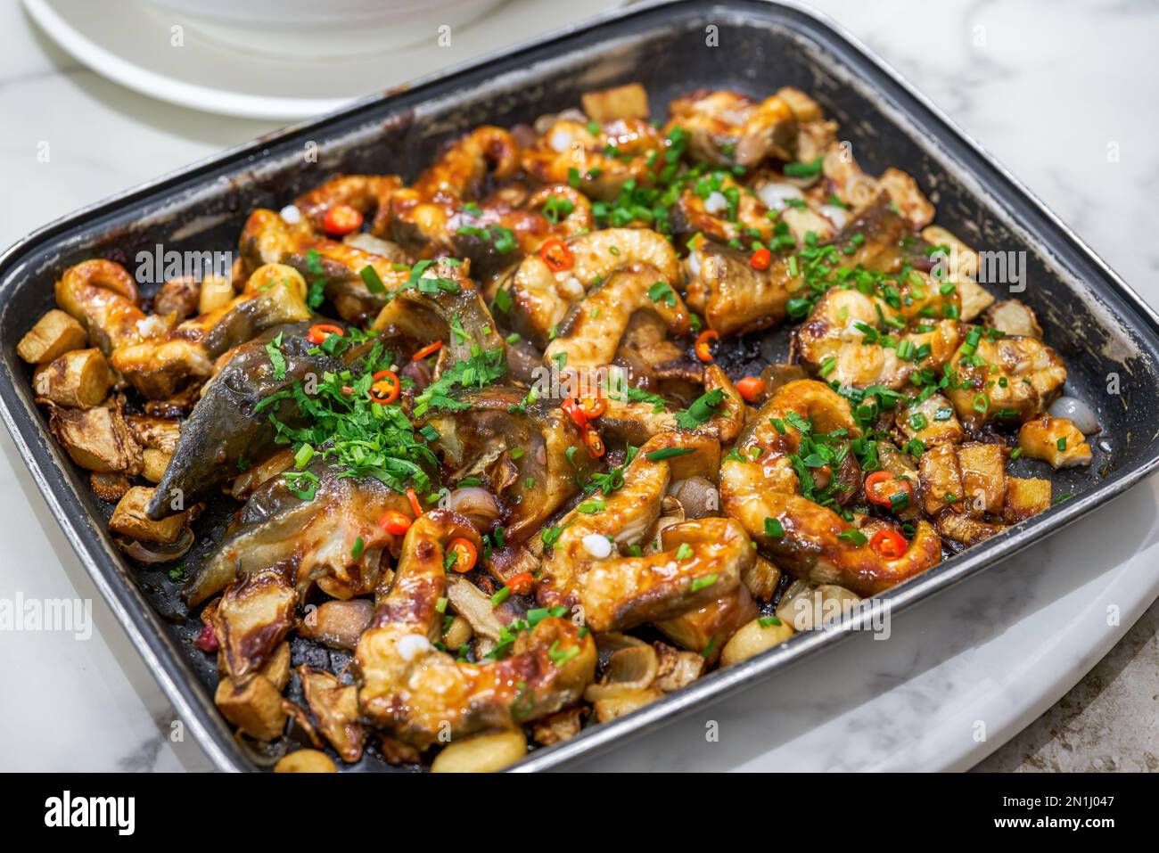 A plate of delicious and spicy Braised Catfish in Hunan Sauce Stock ...