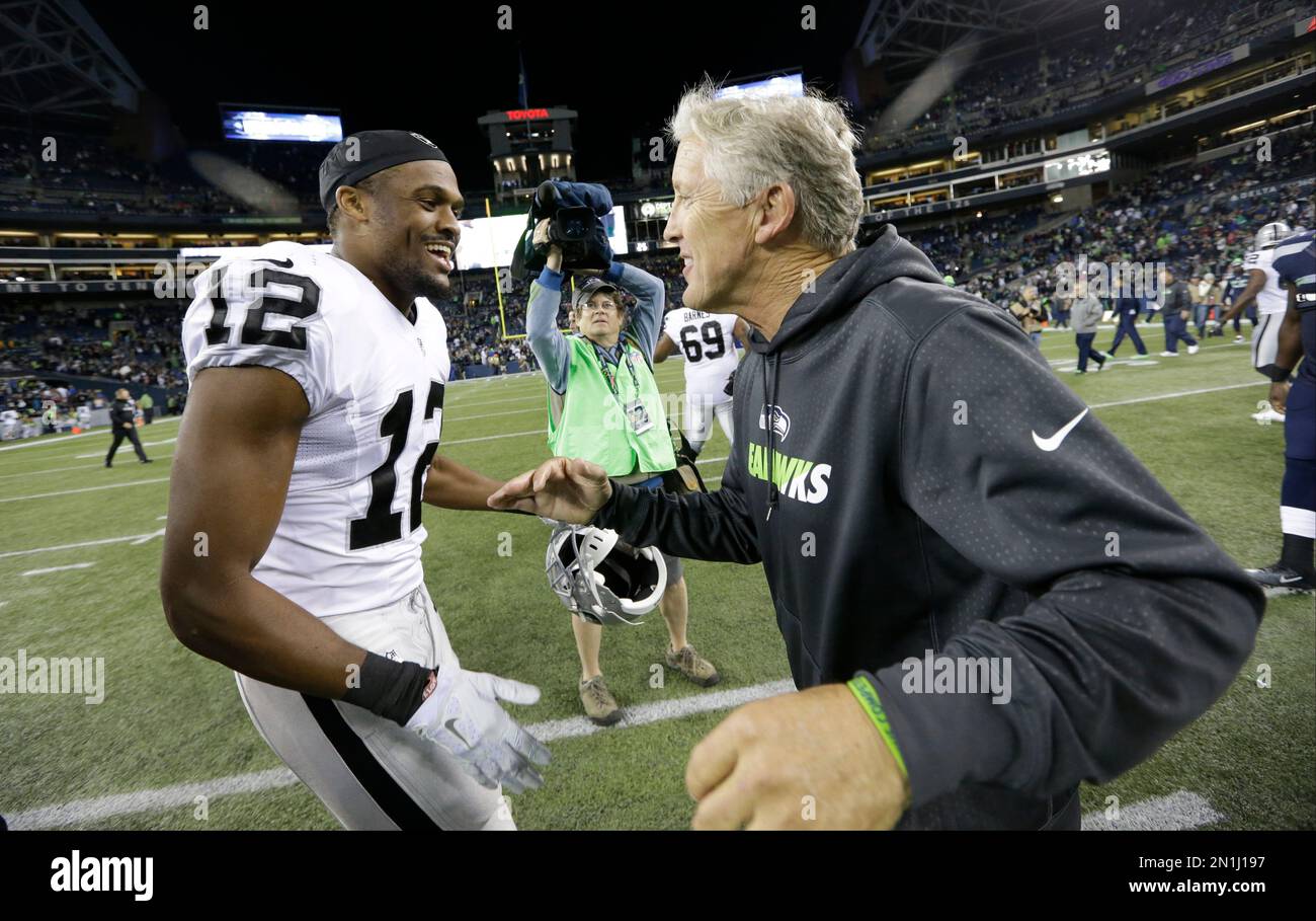 Seattle Seahawks head coach Pete Carroll, right, greets Oakland Raiders ...