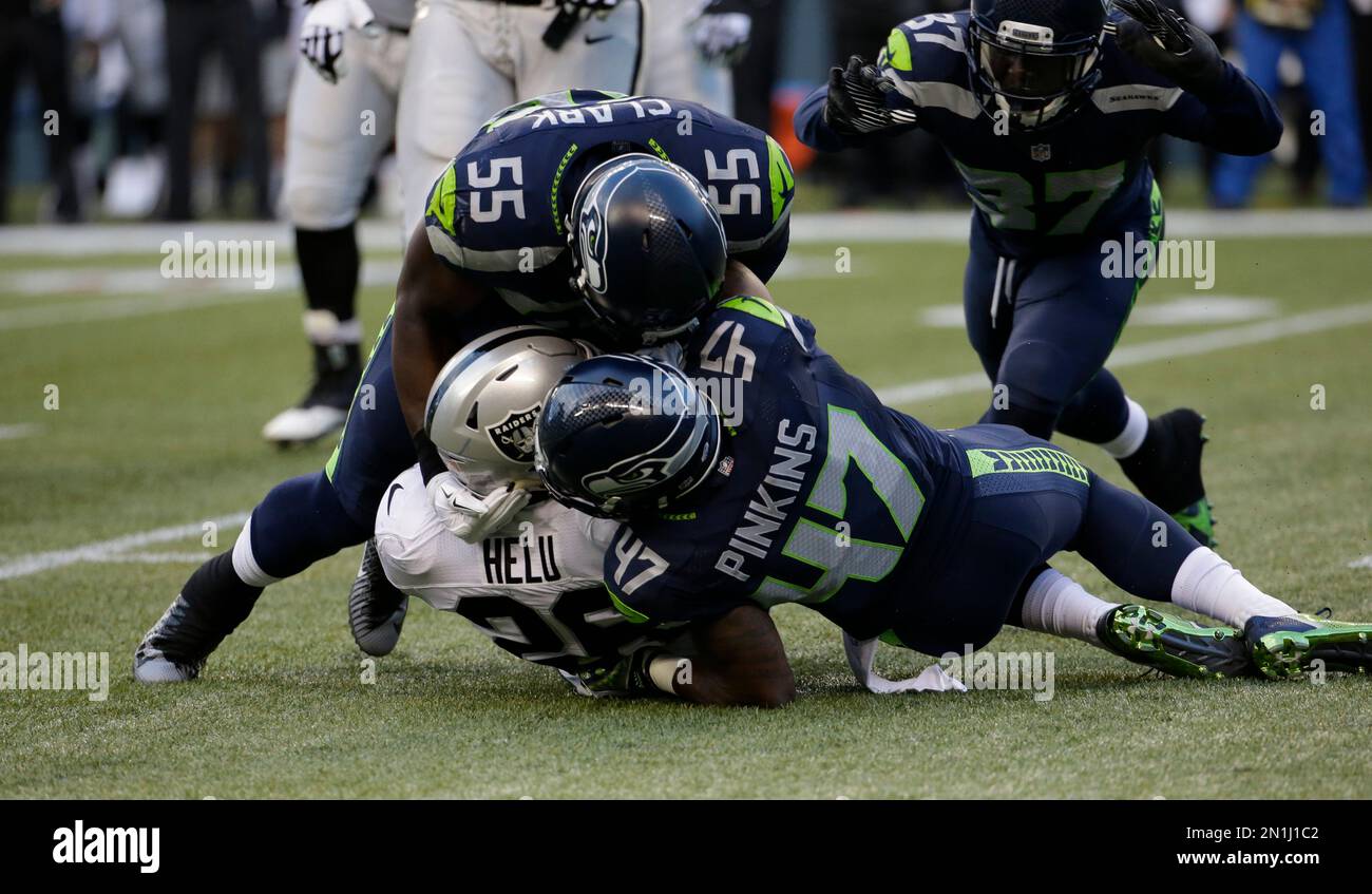 Seattle Seahawks defensive end Frank Clark (55) and linebacker Eric ...