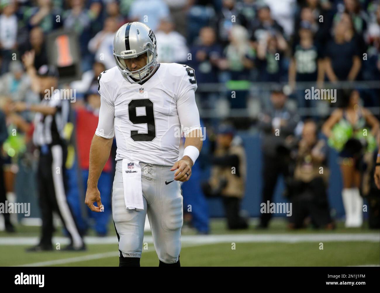 Oakland Raiders quarterback Christian Ponder walks after a play in the ...