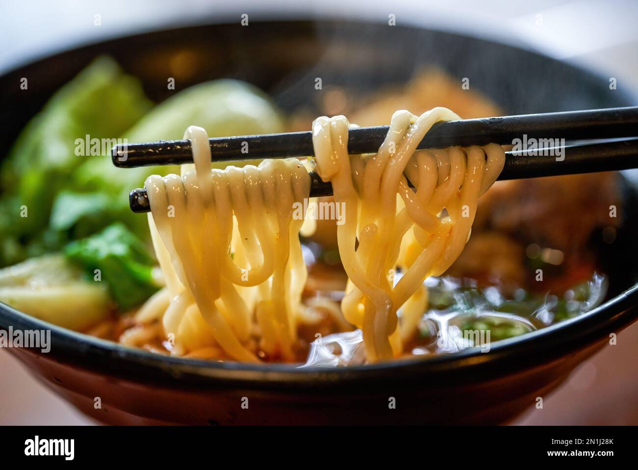 A bowl of delicious and rich Taiwanese braised beef noodles Stock Photo ...